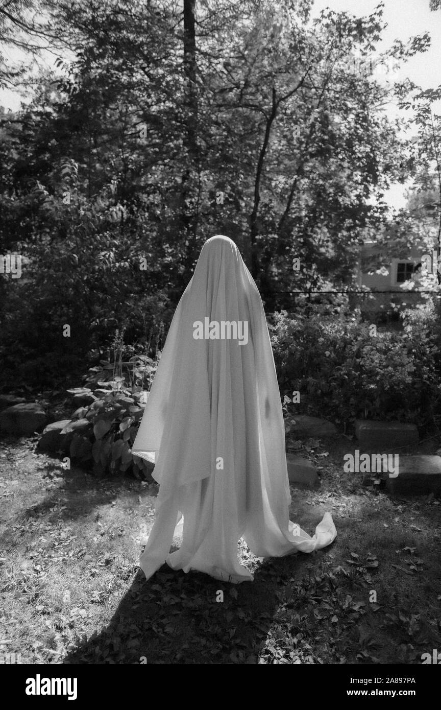 Ghost by trees Stock Photo - Alamy