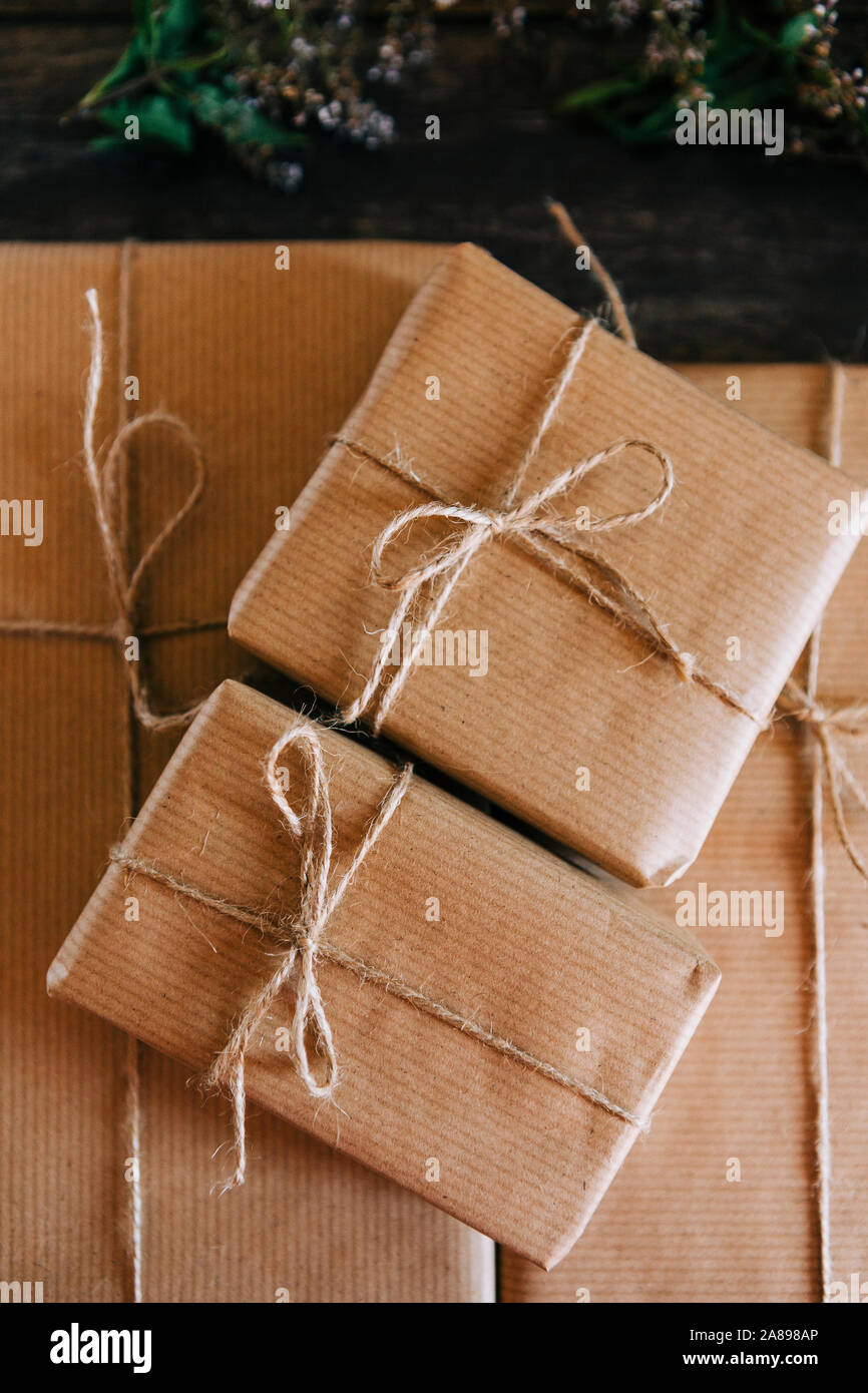 Presents wrapped in brown paper and string Stock Photo - Alamy