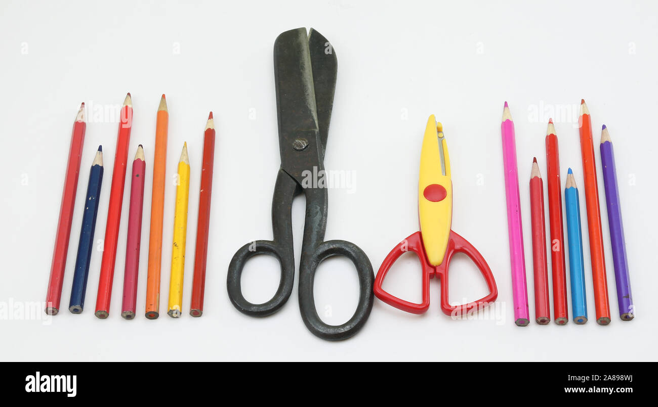 pencils and scissor on white background Stock Photo - Alamy