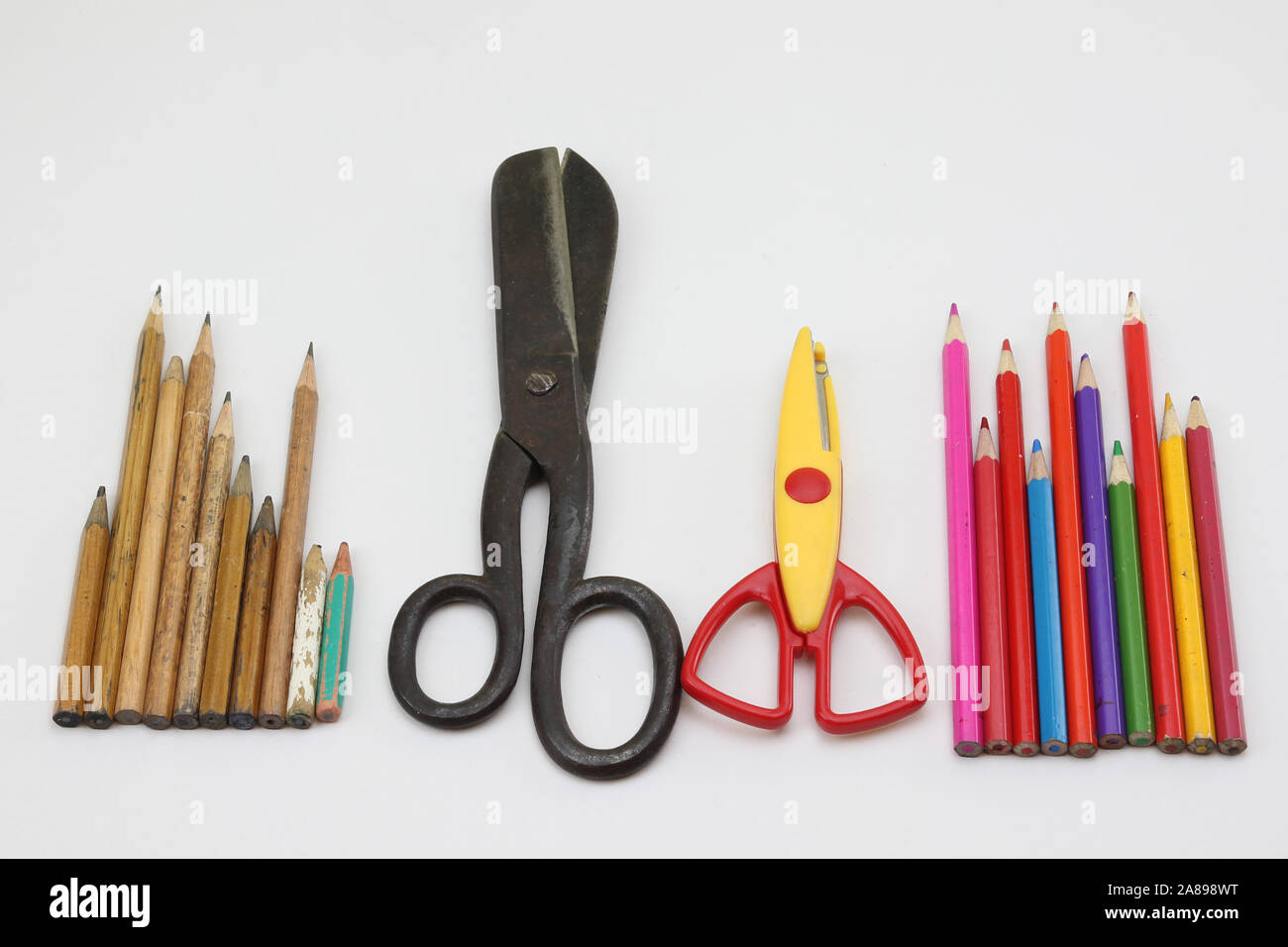 pencils and scissor on white background Stock Photo - Alamy