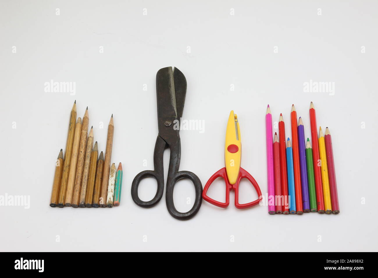 pencils and scissor on white background Stock Photo - Alamy