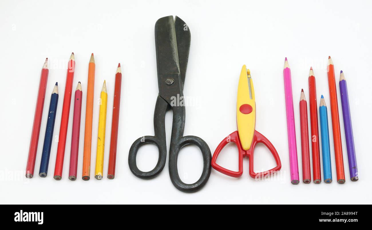 pencils and scissor on white background Stock Photo - Alamy