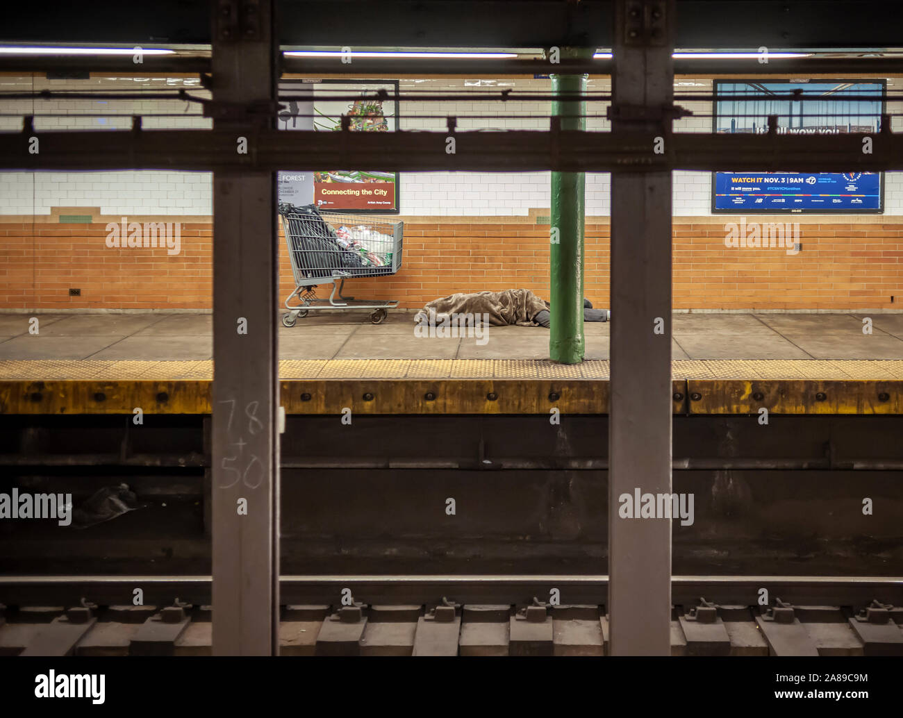 Homeless man sleeping in subway hi-res stock photography and images - Alamy