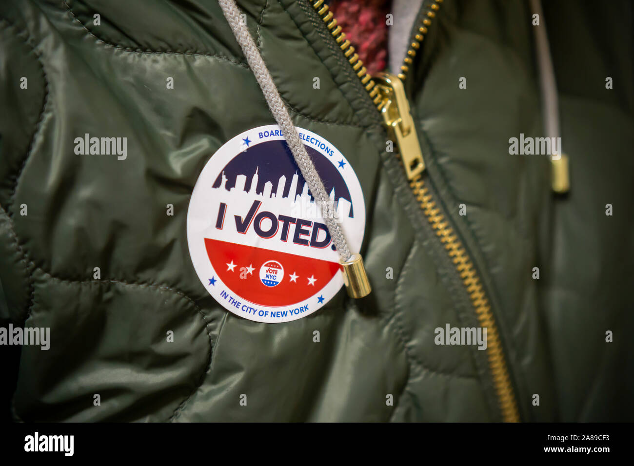 A voter wears her "I Voted" sticker on Election Day in New York on ...