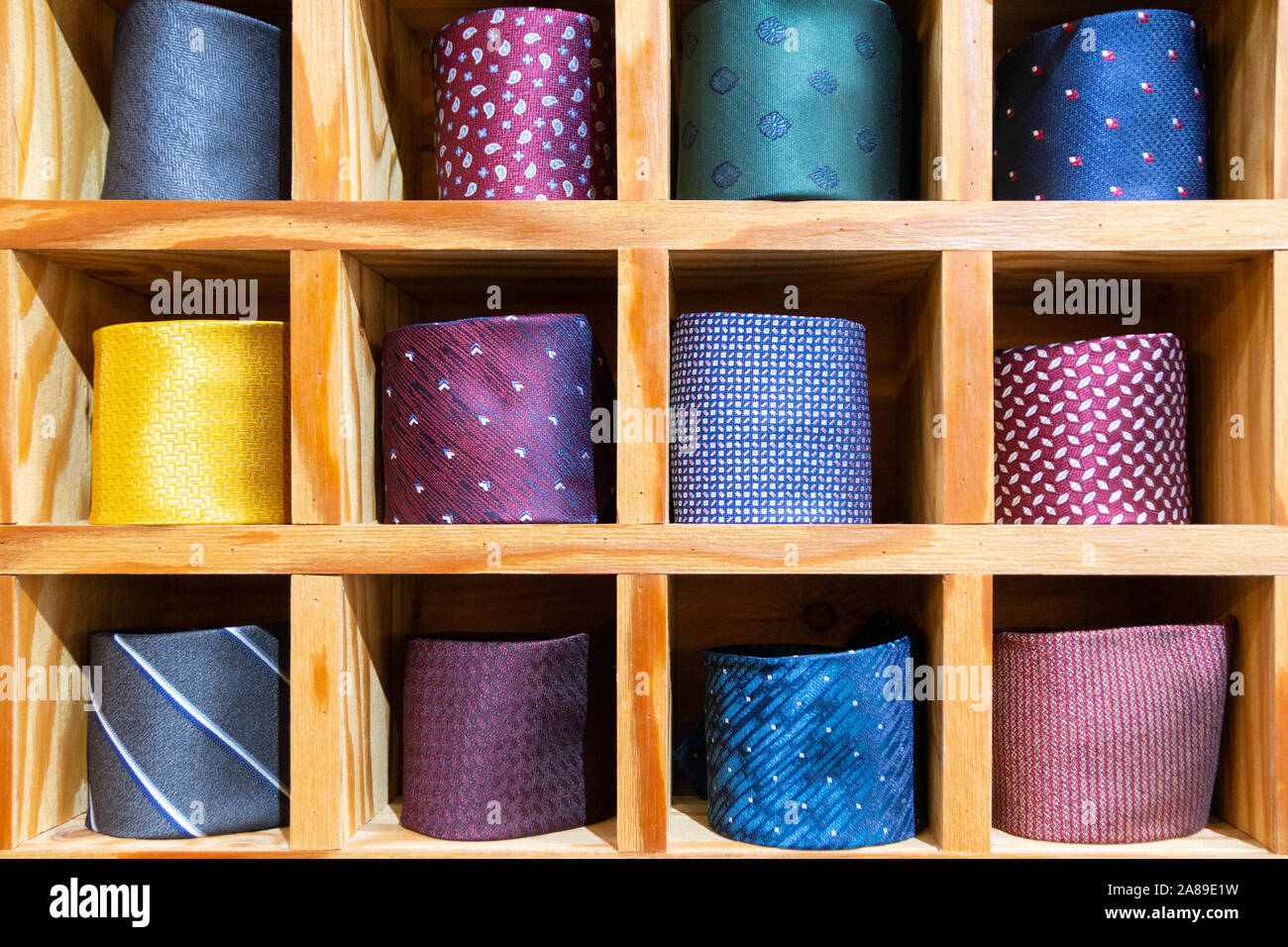 Colorful neckties arranged in a grid shelf Stock Photo - Alamy
