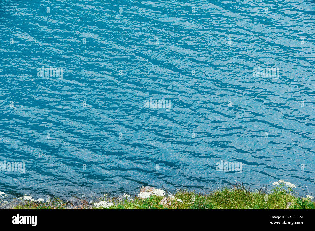 Smooth surface of lake with blue water, turquoise sea as background ...