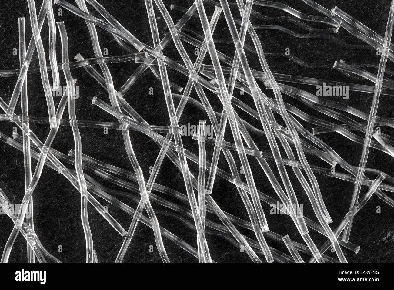 Extreme close up, top down view of polypropylene crimped macro fibers ...