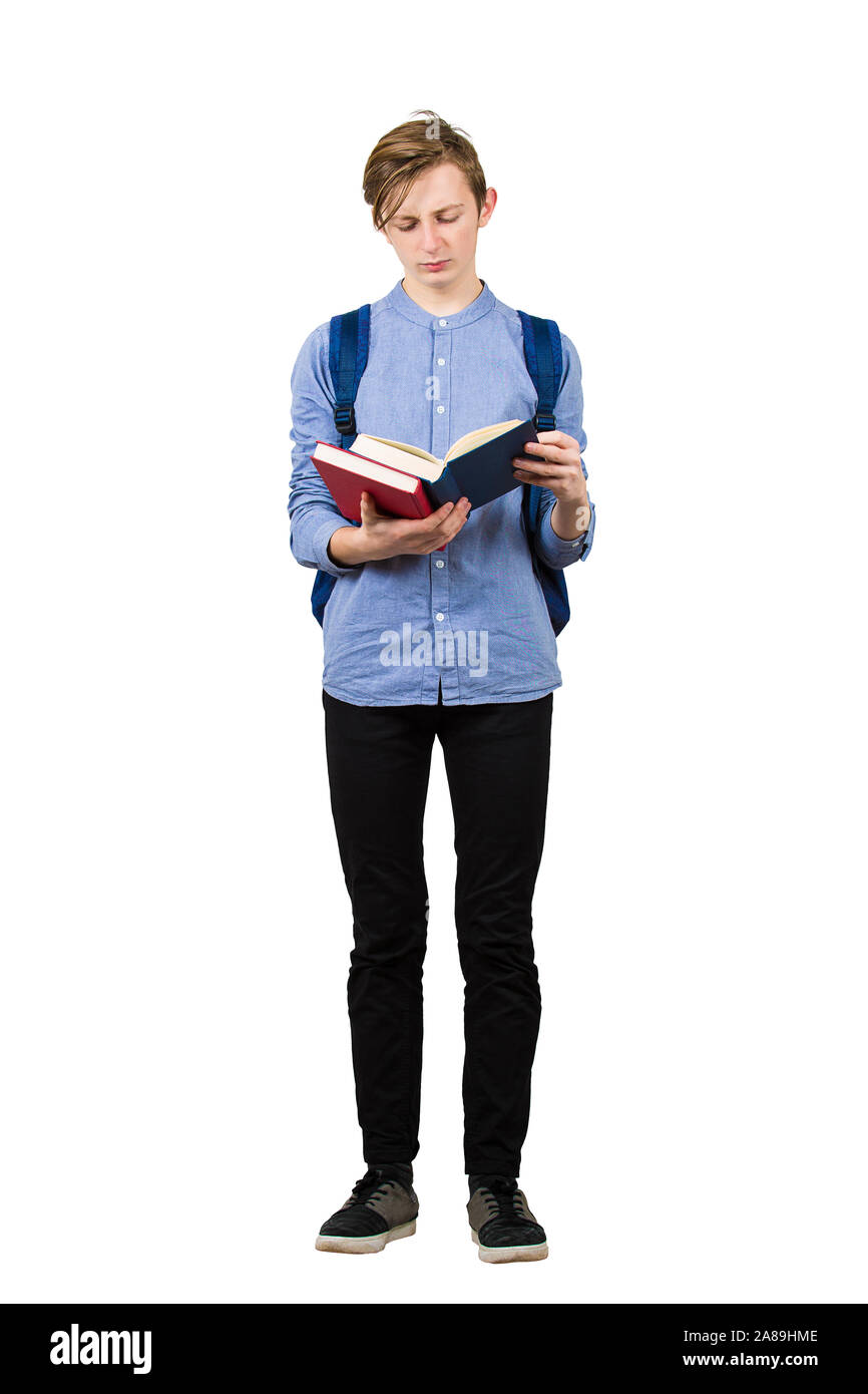 Puzzled boy teenager, student reader looking amazed in a book. Confused ...