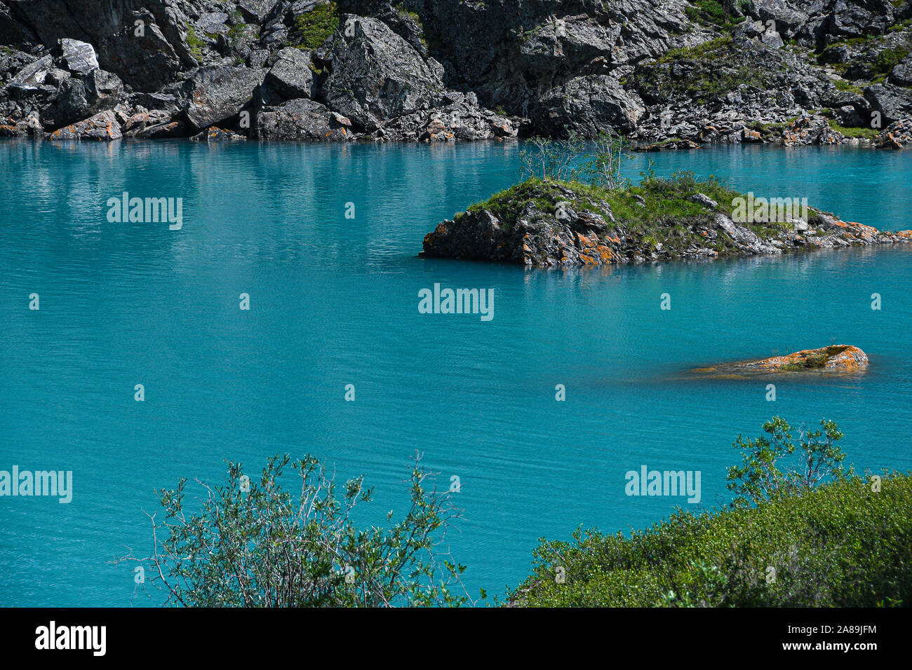 Turquoise lake among rocks. Mountain pond for hiking Stock Photo - Alamy