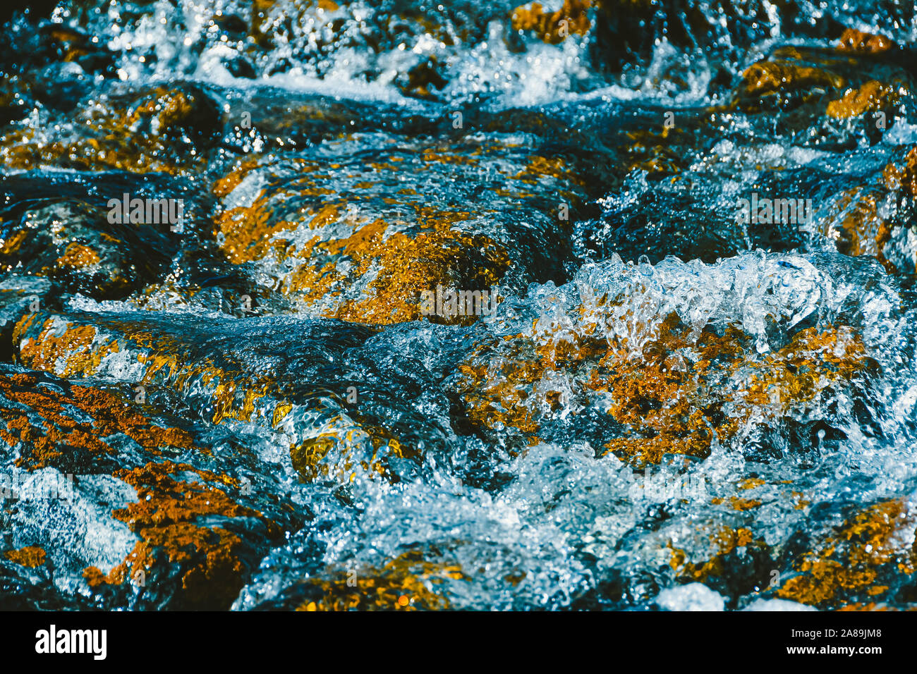 Mountain stream flowing into sea hi-res stock photography and images ...