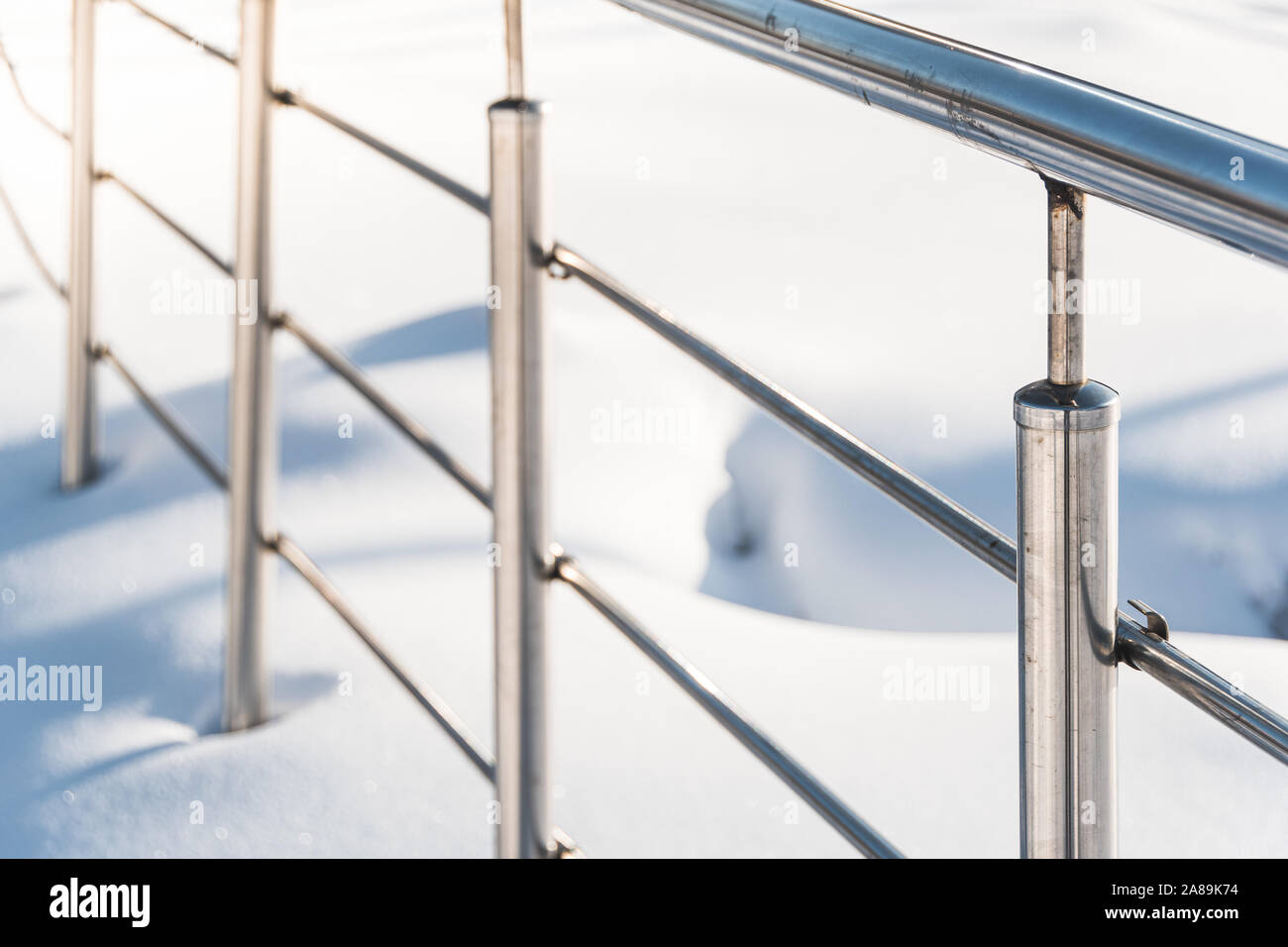 Metal handrail on winter stairs. Dangerous stairs under snow, safe ...