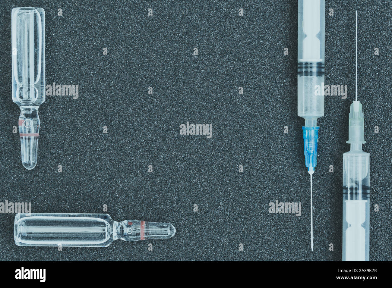 Syringes and vials of medicine on pavement. Hospital treatment ...