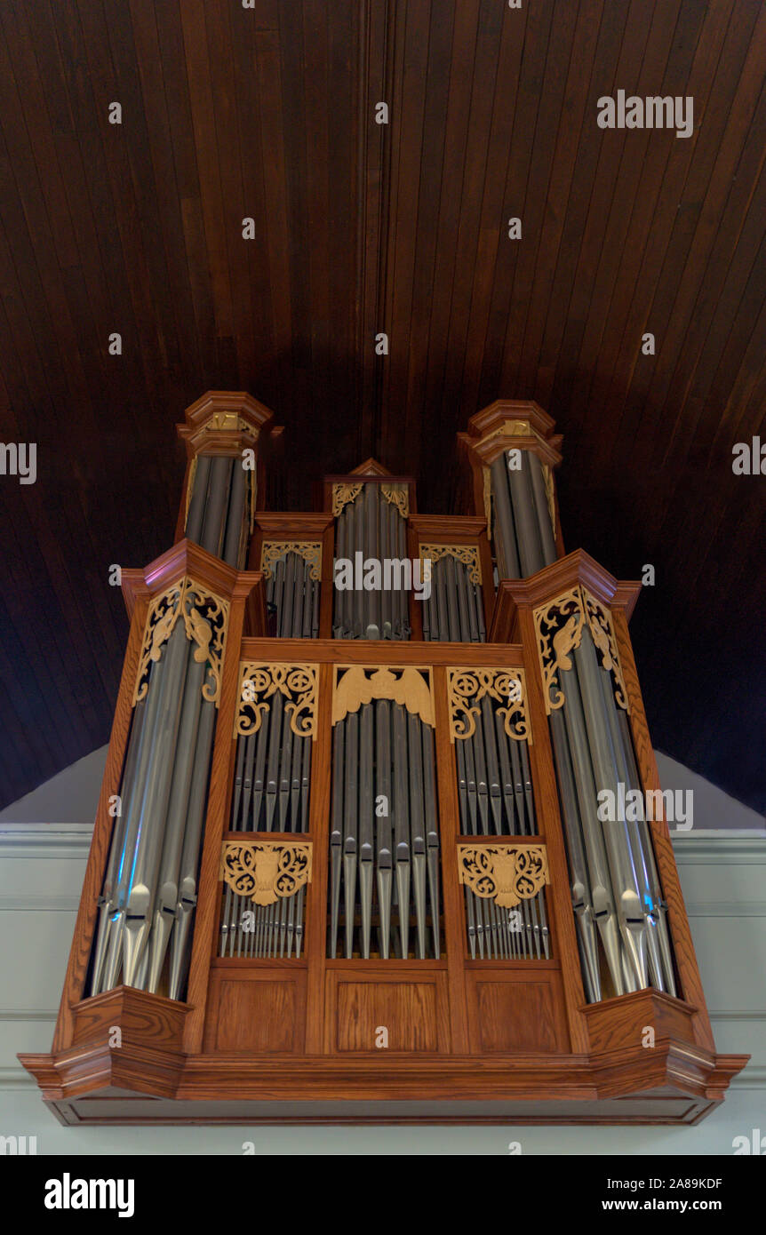 Beautiful old pipes from a pipe organ, mounted high on the wall Stock ...