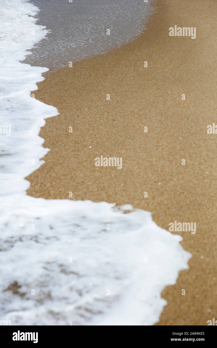 Water and tropical sand beach detail Stock Photo - Alamy