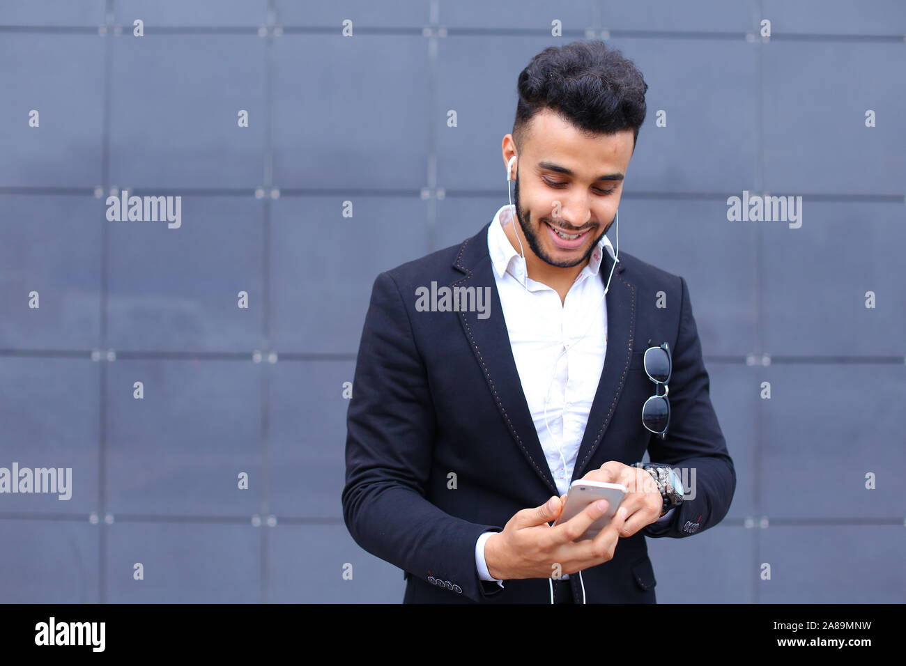 Handsome arabic man takes selfie smart phone in business center Stock ...