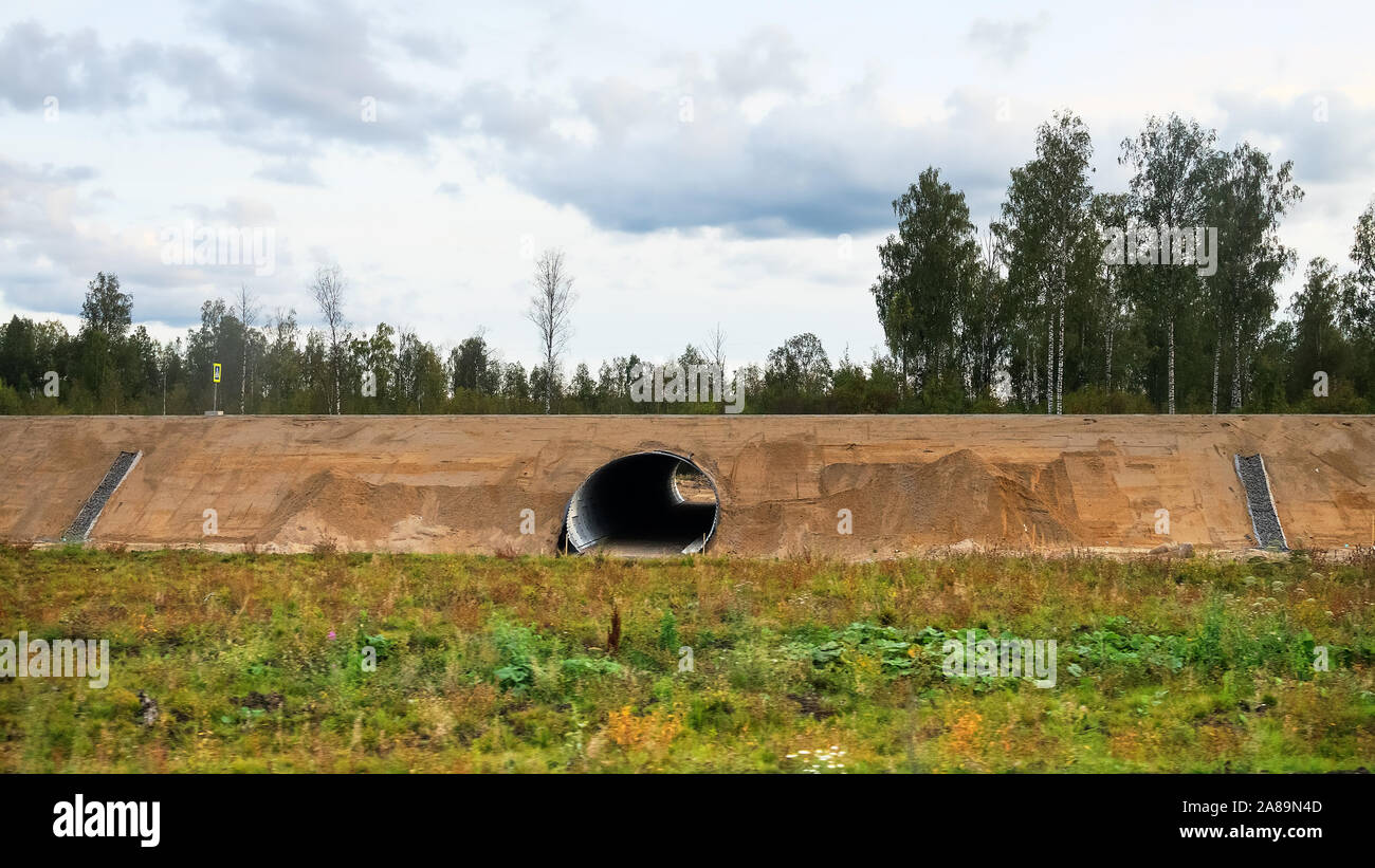 Construction of the highway. Laying culvert in sand bed Stock Photo - Alamy