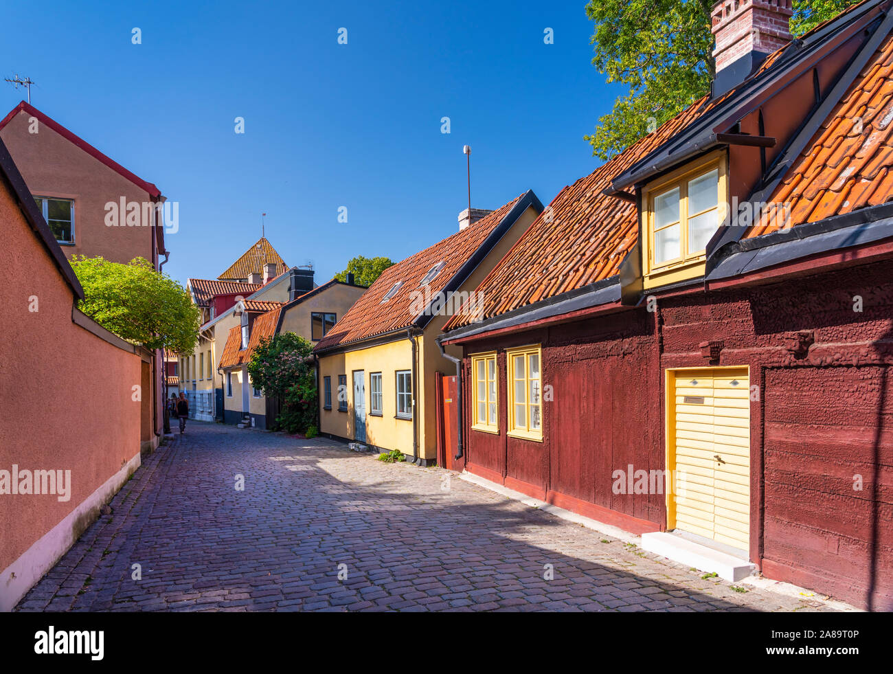 A street view with homes and buildings featuring the architecture of ...
