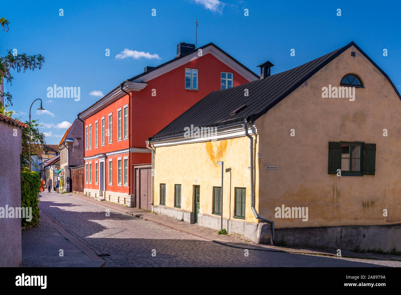A street view with homes and buildings featuring the architecture of ...