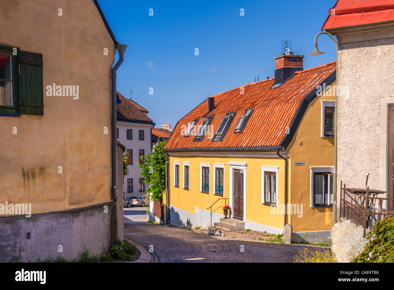 A street view with homes and buildings featuring the architecture of ...