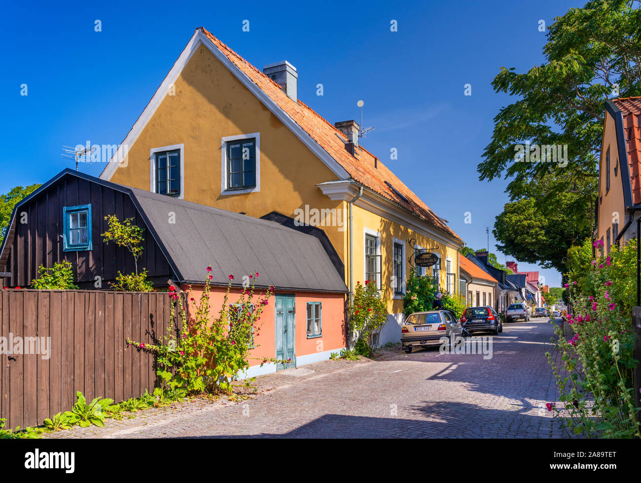 A street view with homes and buildings featuring the architecture of ...