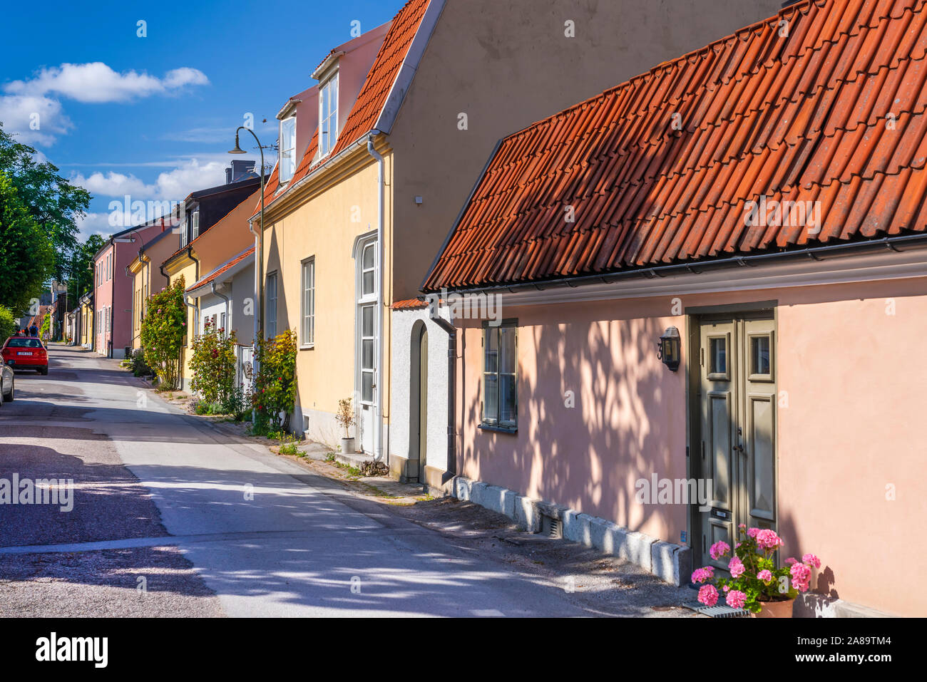 A street view with homes and buildings featuring the architecture of ...
