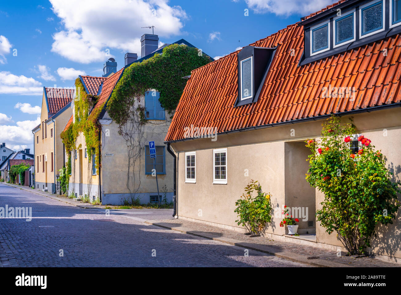 A street view with homes and buildings featuring the architecture of ...