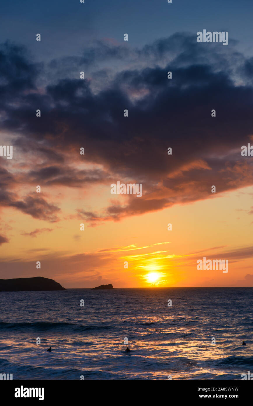 A beautiful intense sunset over Fistral Bay in Newquay in Cornwall ...
