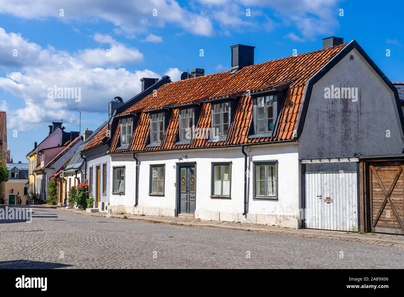 A street view with homes and buildings featuring the architecture of ...