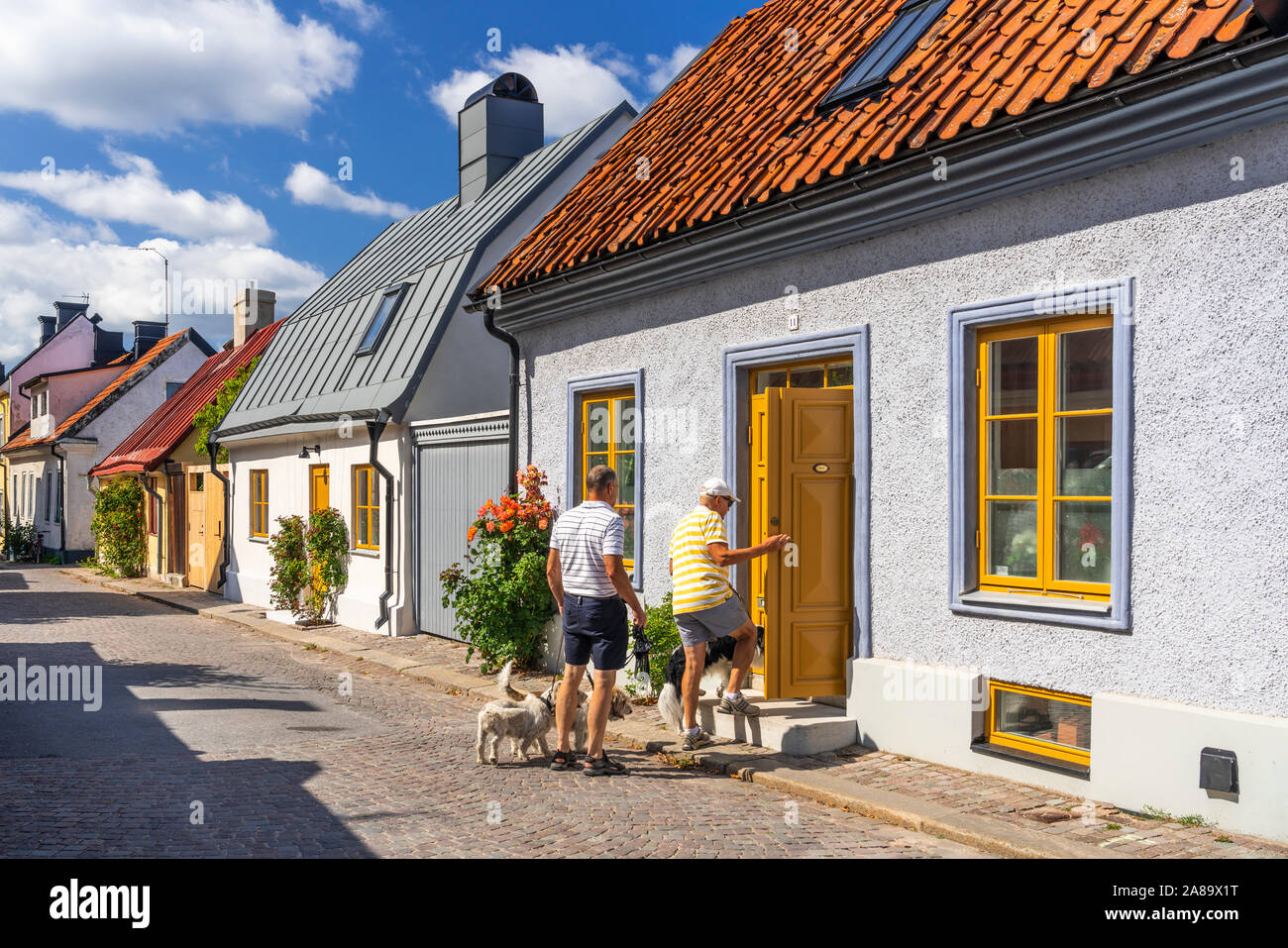 A street view with homes and buildings featuring the architecture of ...