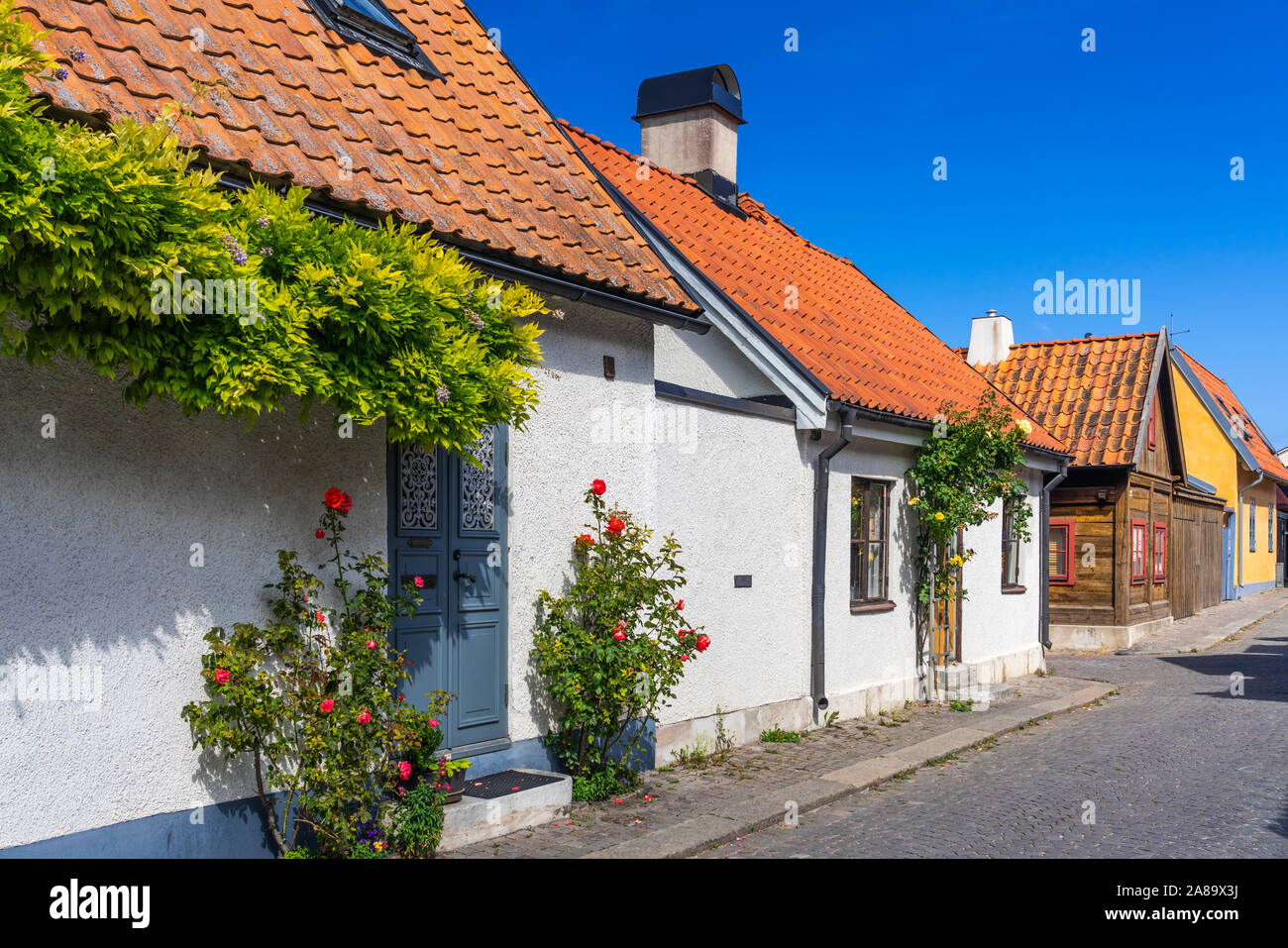 A street view with homes and buildings featuring the architecture of ...