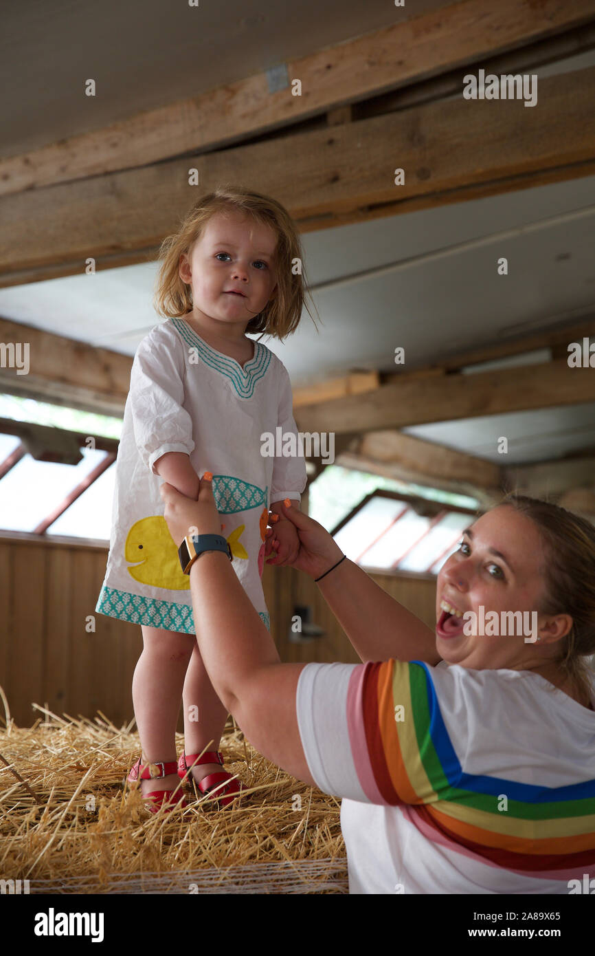Kids Playing in a stable Stock Photo - Alamy