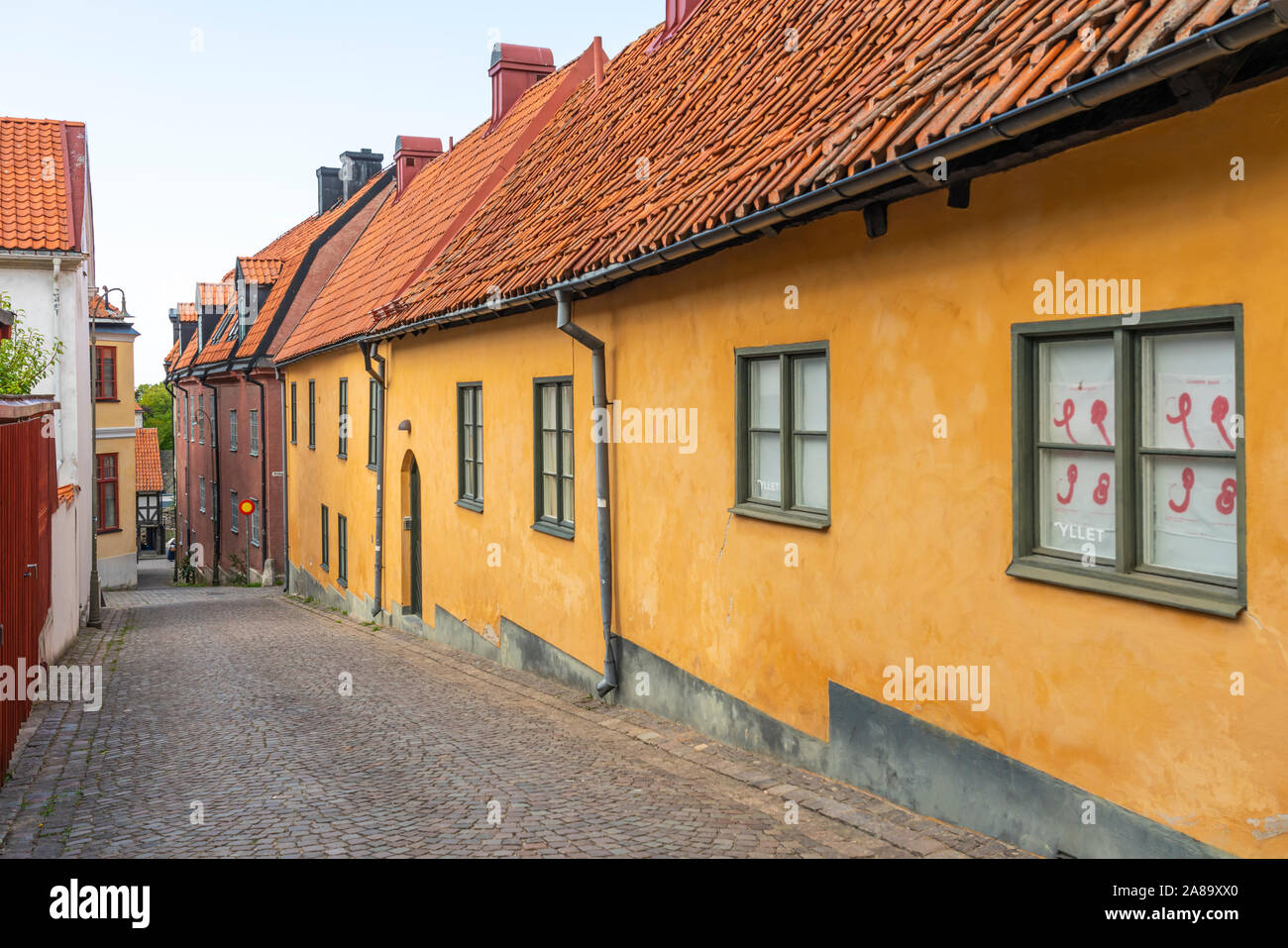 A street view with homes and buildings featuring the architecture of ...