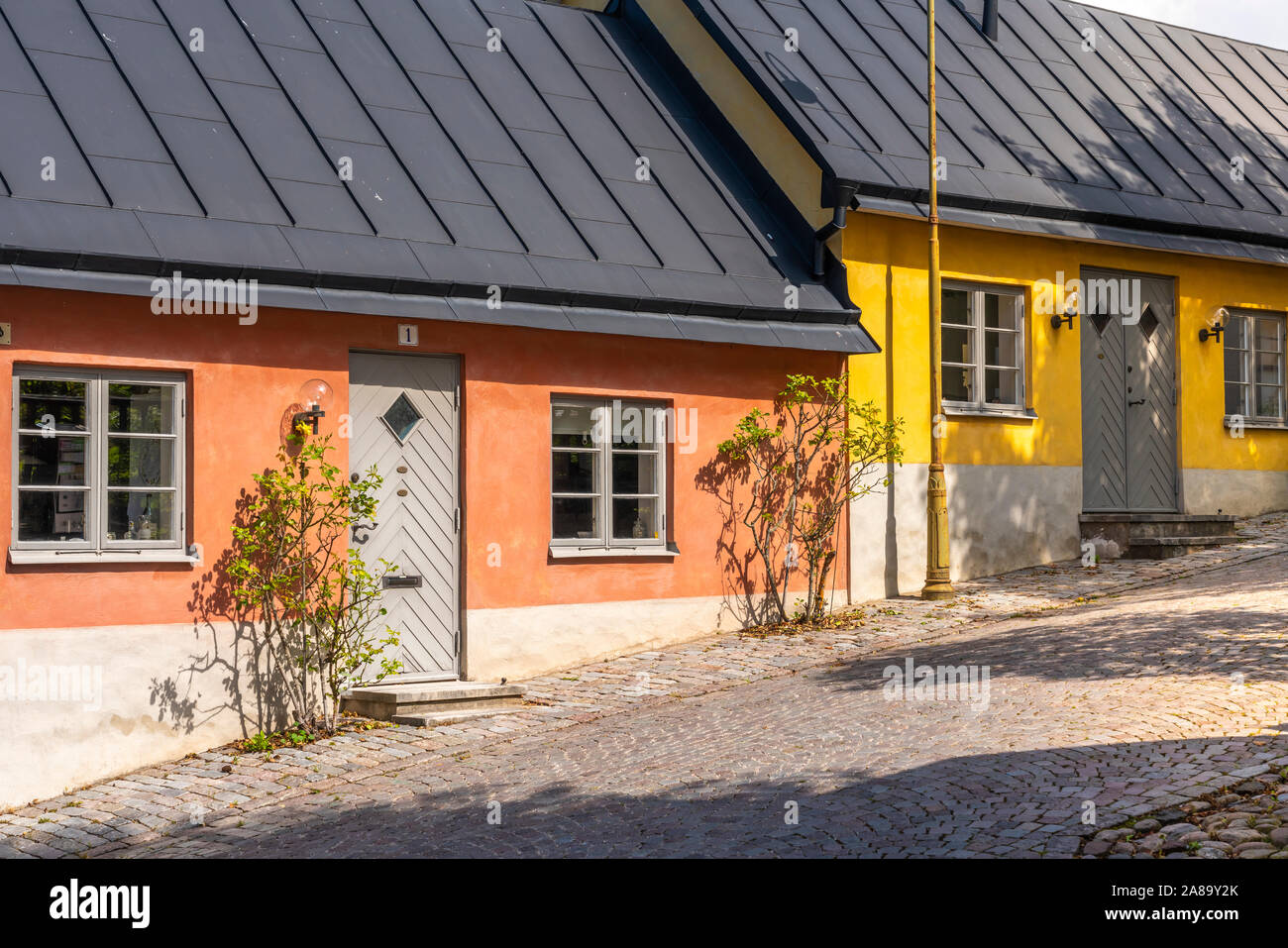 A street view with homes and buildings featuring the architecture of ...
