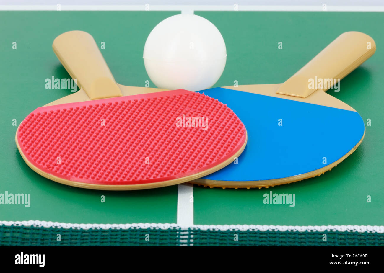 Rackets and ball for table tennis on the green table Stock Photo - Alamy