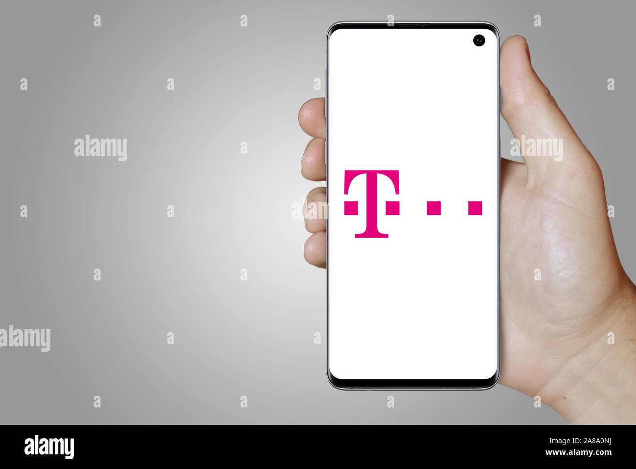 Logo of public company Deutsche Telekom displayed on a smartphone. Grey ...
