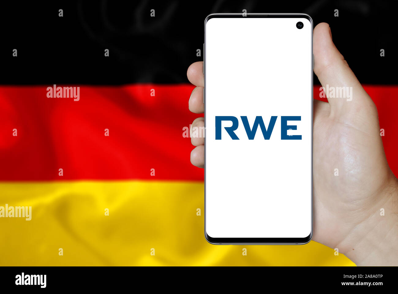 Logo of public company RWE displayed on a smartphone. Flag of Germany ...