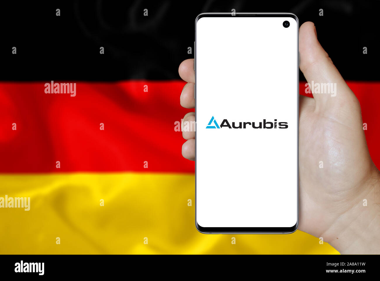Logo of public company Aurubis AG displayed on a smartphone. Flag of Germany background. Credit ...