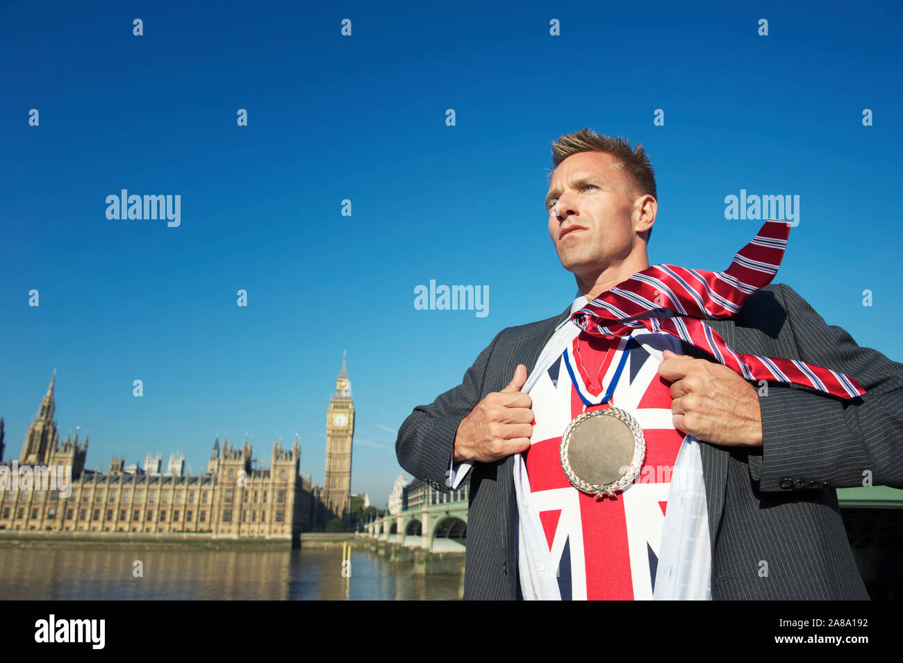 Serious superhero businessman pulling open his suit to reveal inner ...