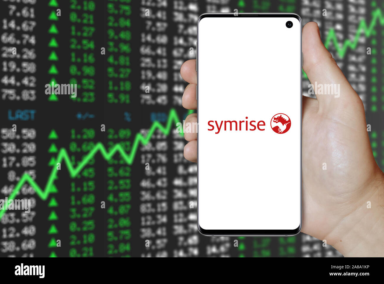 Logo of public company Symrise displayed on a smartphone. Positive ...
