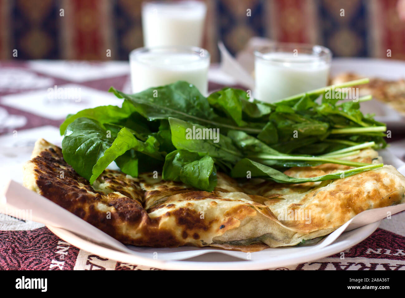 Traditional turkish gozleme tortilla, homemade ayran and arugula Stock ...