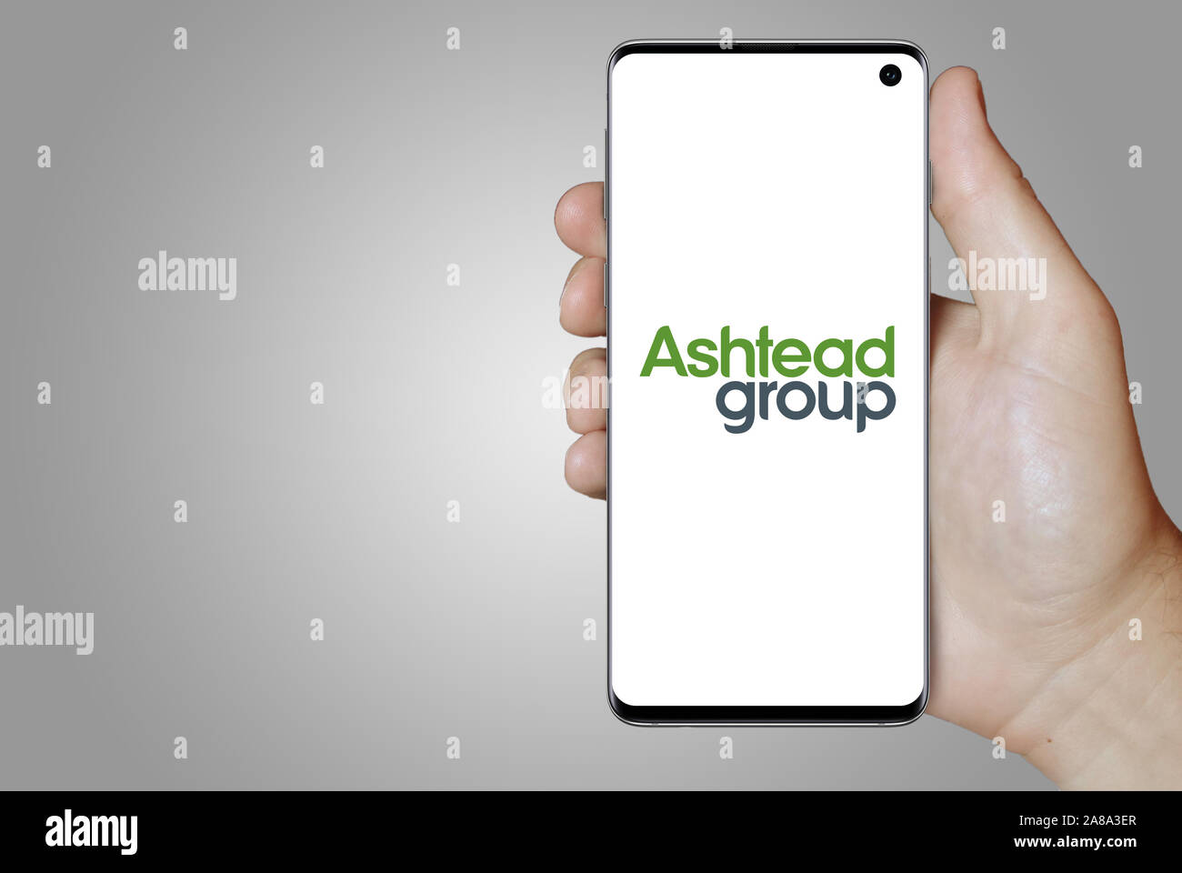 Logo of public company Ashtead Group displayed on a smartphone. Grey ...