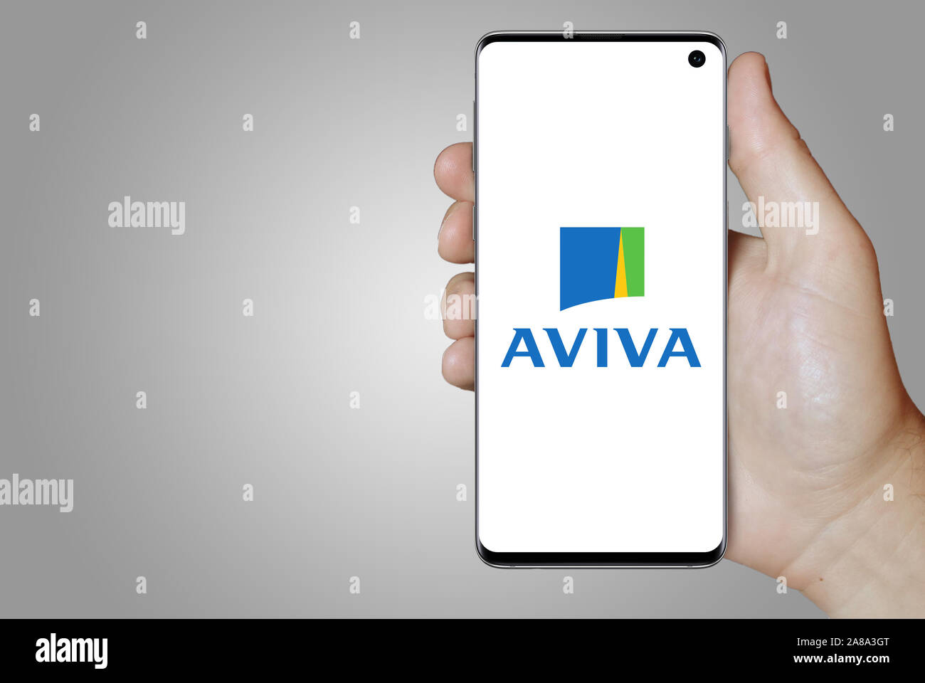 Logo of public company Aviva displayed on a smartphone. Grey background ...