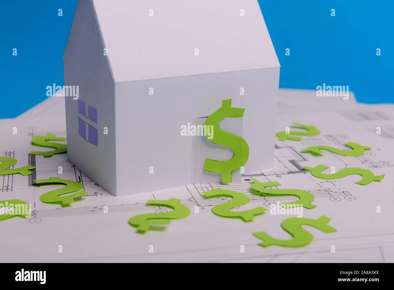 Paper skyscrapers , us dollar money, house projects plan and blueprints ...