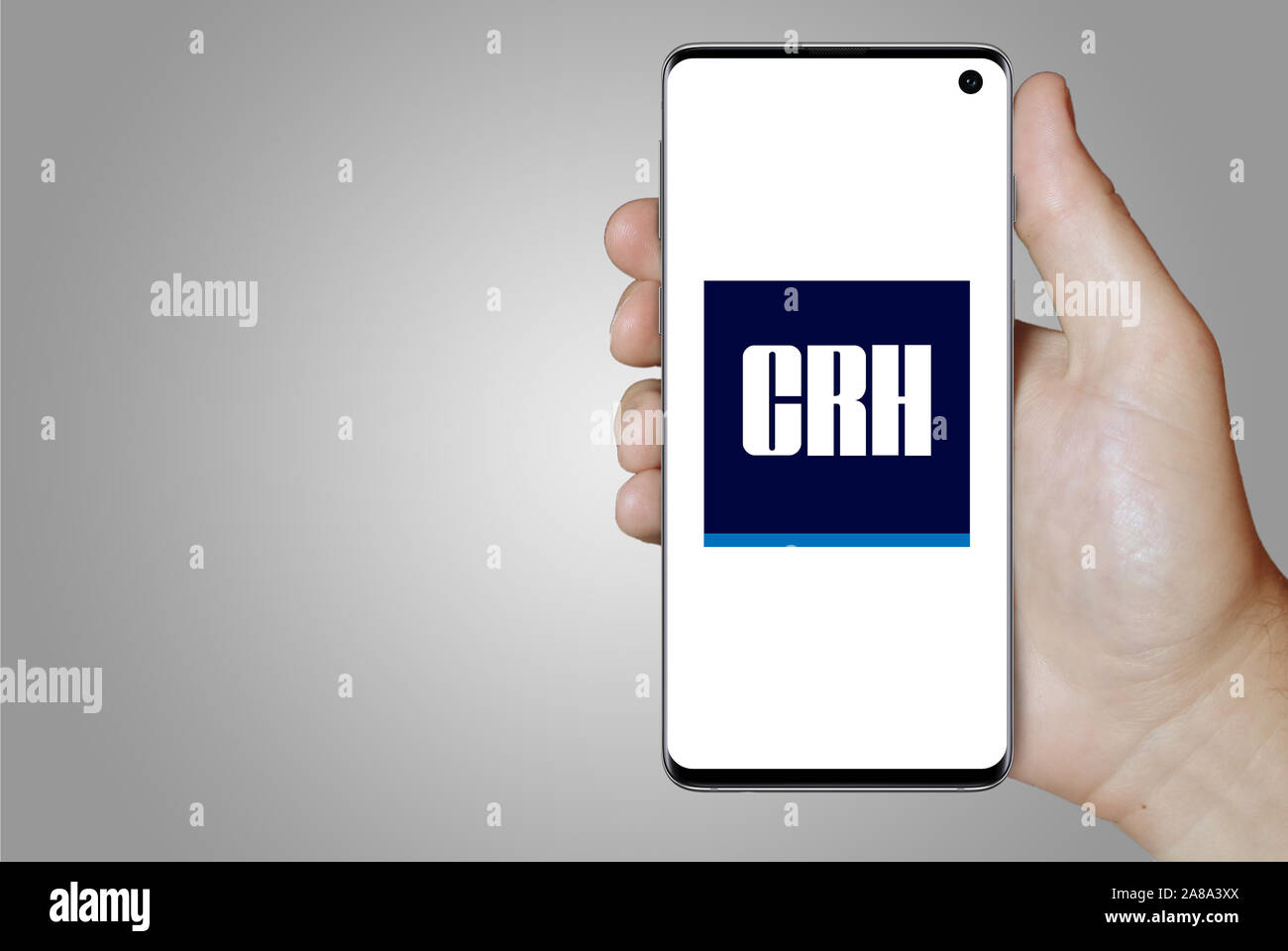 Logo of public company CRH plc displayed on a smartphone. Grey ...