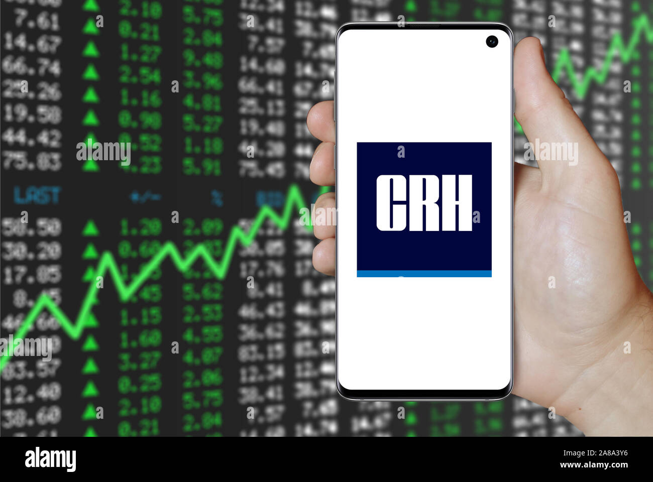 Logo of public company CRH plc displayed on a smartphone. Positive ...
