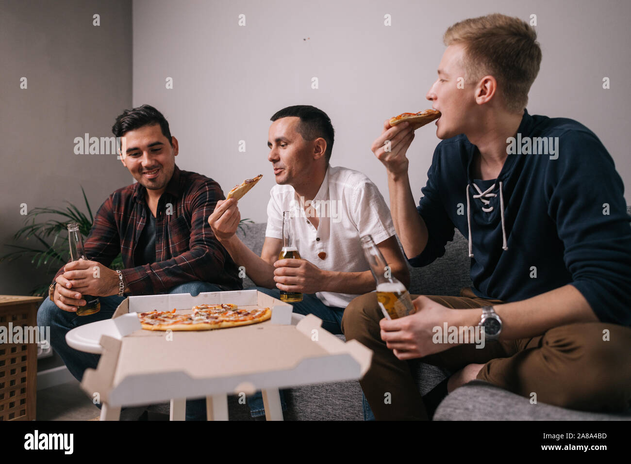 Young Guys Eating Dinner High Resolution Stock Photography and Images ...