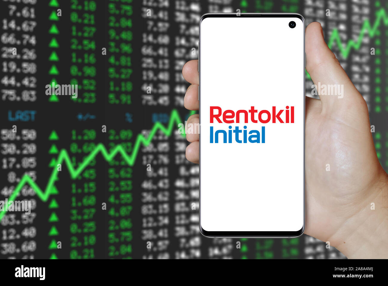 Logo of public company Rentokil Initial displayed on a smartphone ...