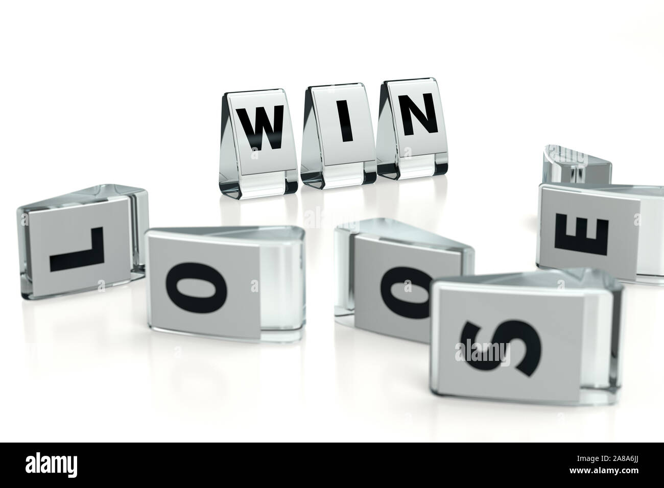 WIN word written on glossy blocks and fallen over blurry blocks with ...