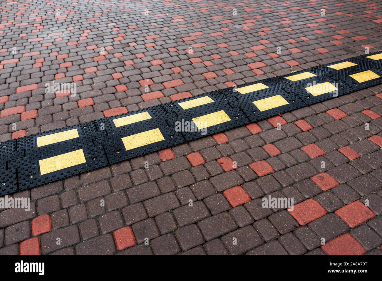 Speed bump on the road Stock Photo - Alamy