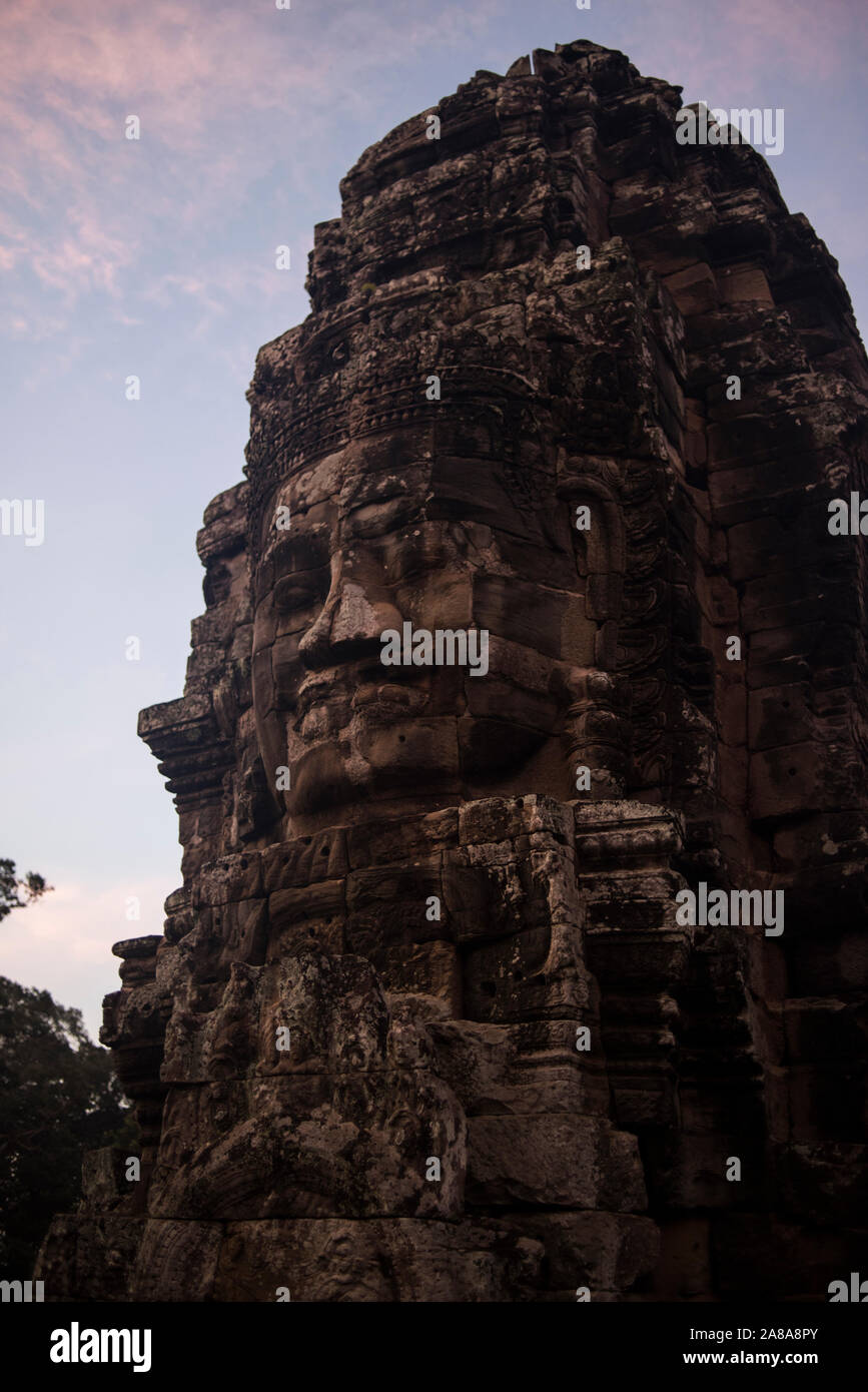 Stone carved Buddha head in Bayon at the Angkor Thom temple in Angkor ...